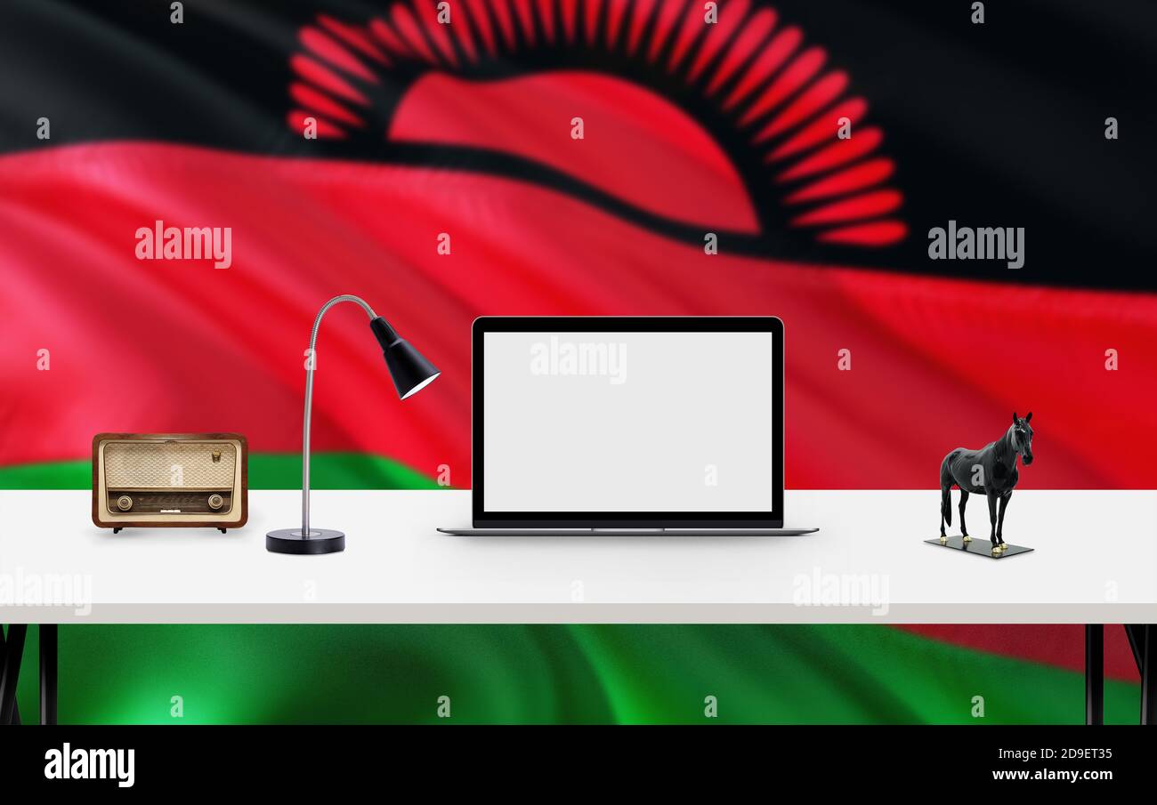 Malawi national flag background with workspace, desktop computer and ...