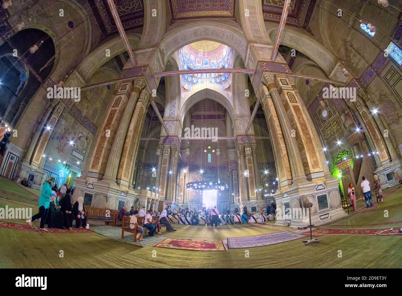 Most of the walls of the mosque are covered with colorful marble with ...