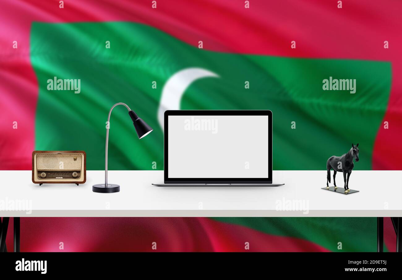 Maldives national flag background with workspace, desktop computer and ...