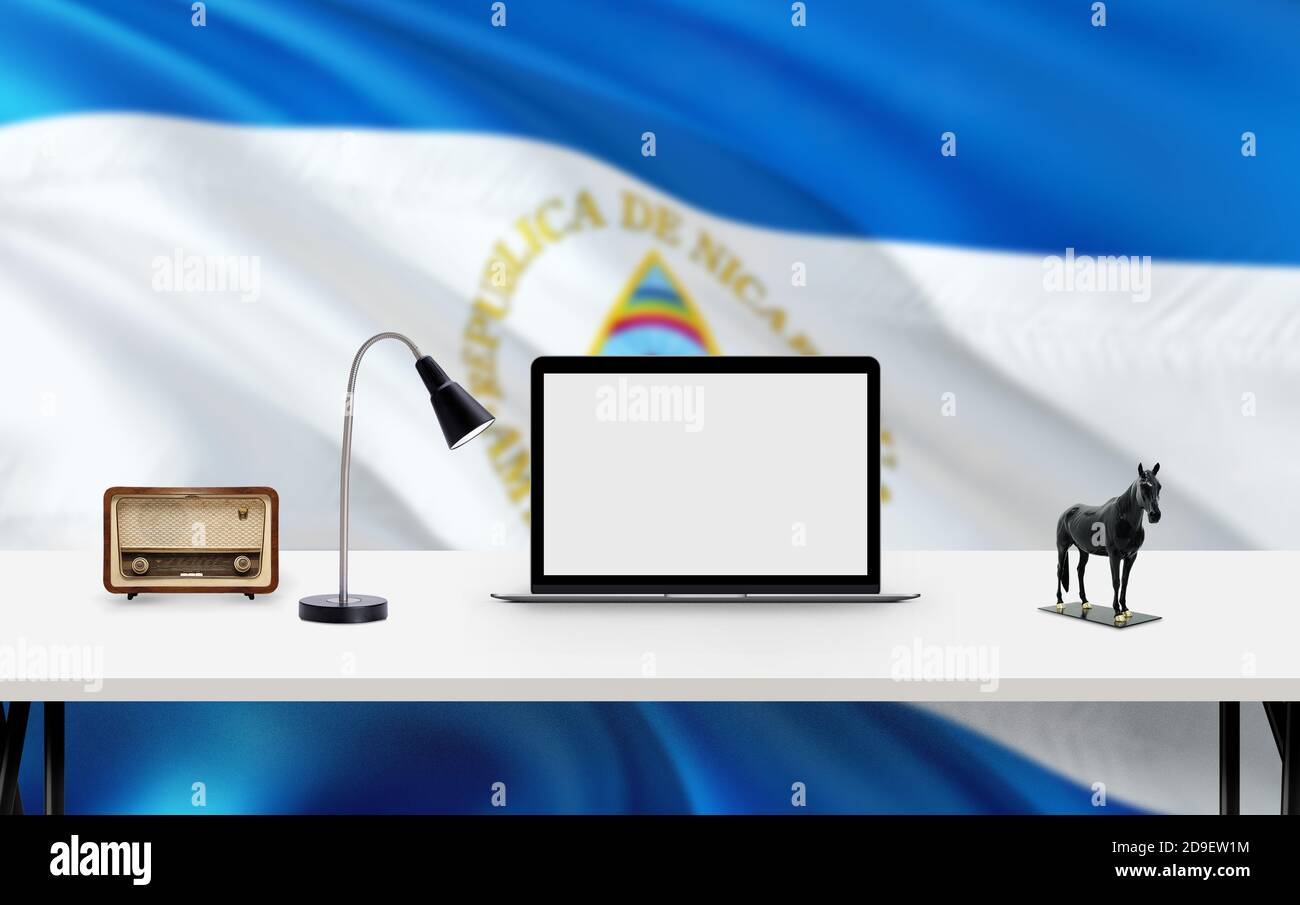 Nicaragua national flag background with workspace, desktop computer and ...