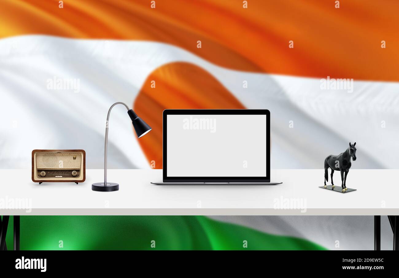 Niger national flag background with workspace, desktop computer and ...