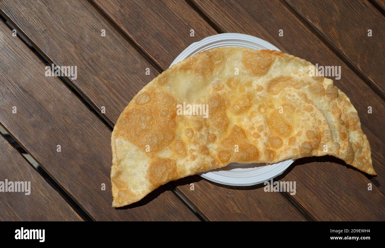 Muslim pies. Eastern pastries with filling. Chebureks with cheese with ...