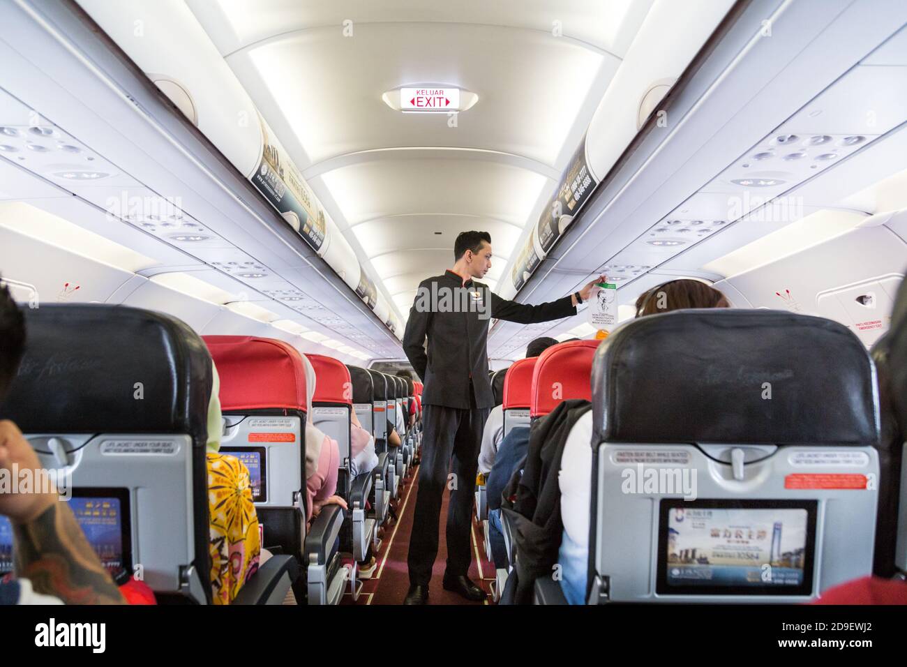 Series of steward demonstrating safety prosedure prior to commercial ...