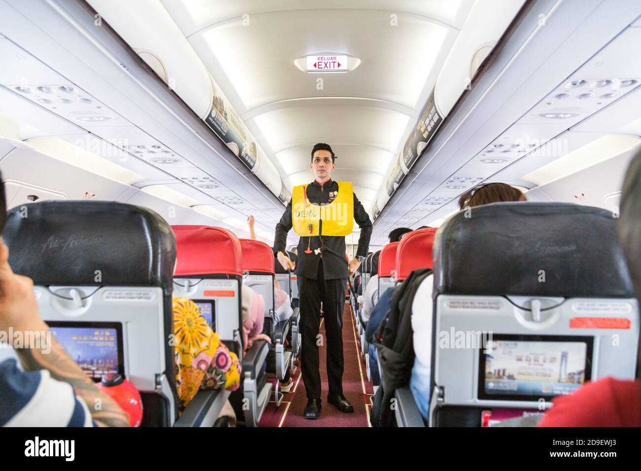 Series of steward demonstrating safety prosedure prior to commercial ...