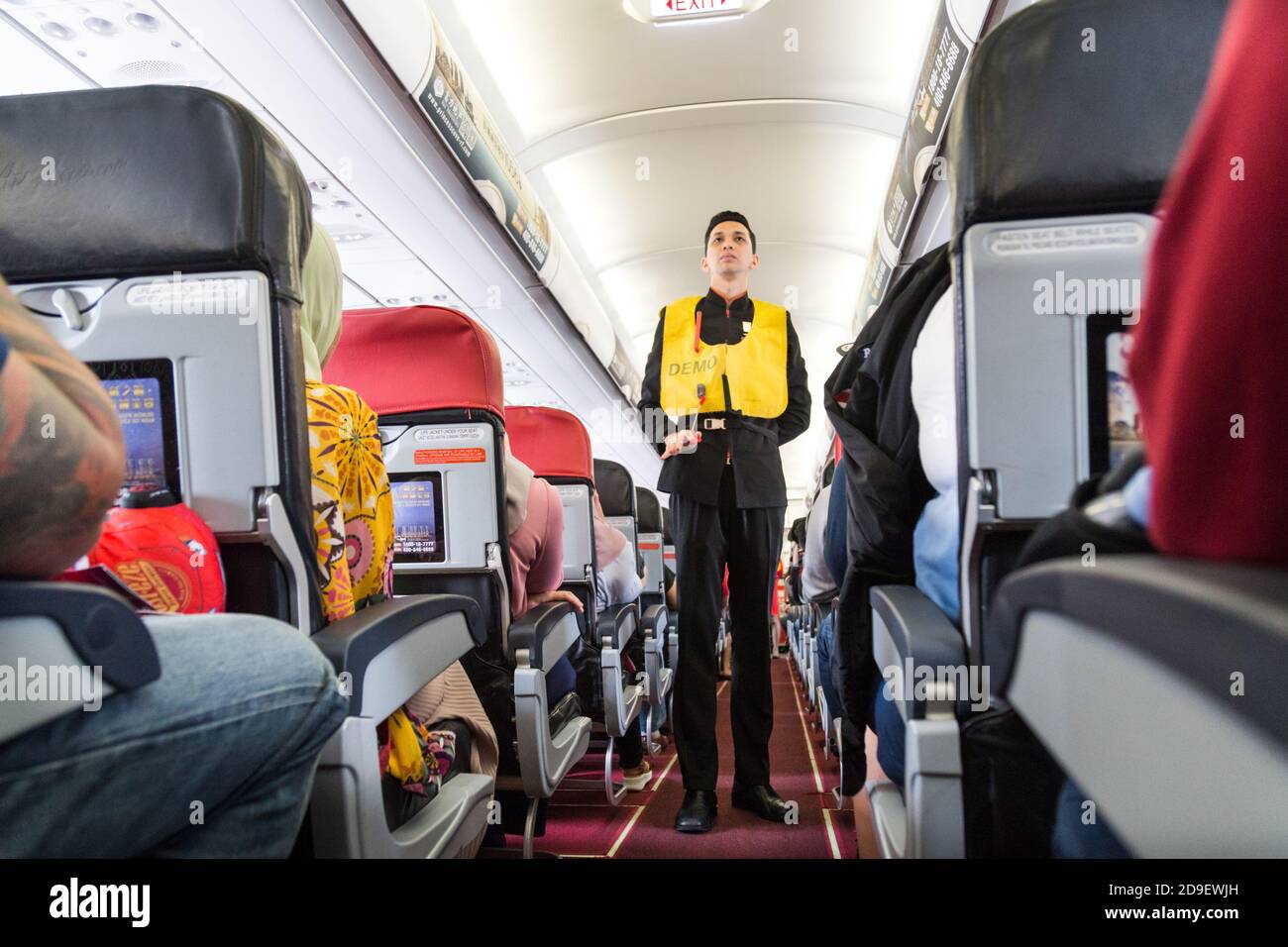 Series of steward demonstrating safety prosedure prior to commercial ...