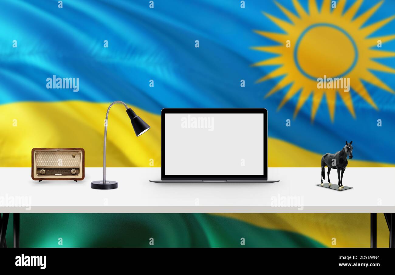 Rwanda national flag background with workspace, desktop computer and ...