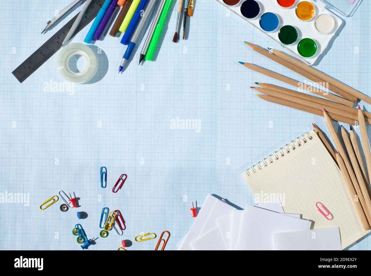 Frame for text with school supplies. Paints pens pencils brushes ...