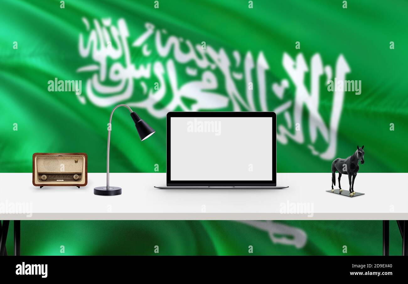 Saudi Arabia national flag background with workspace, desktop computer ...
