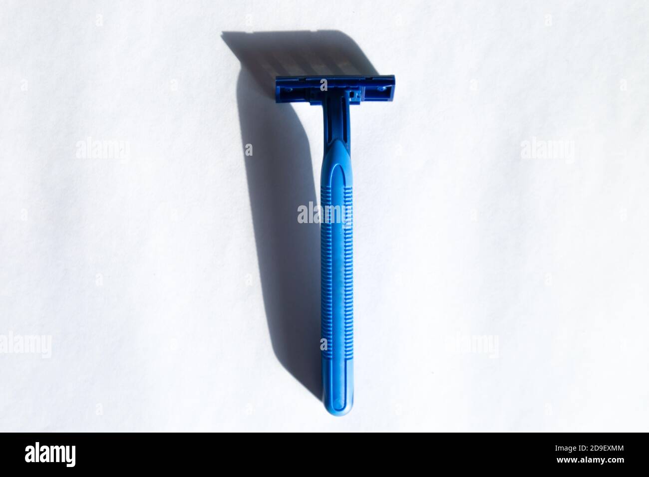Blue men's razor on a white background. View from above Stock Photo - Alamy