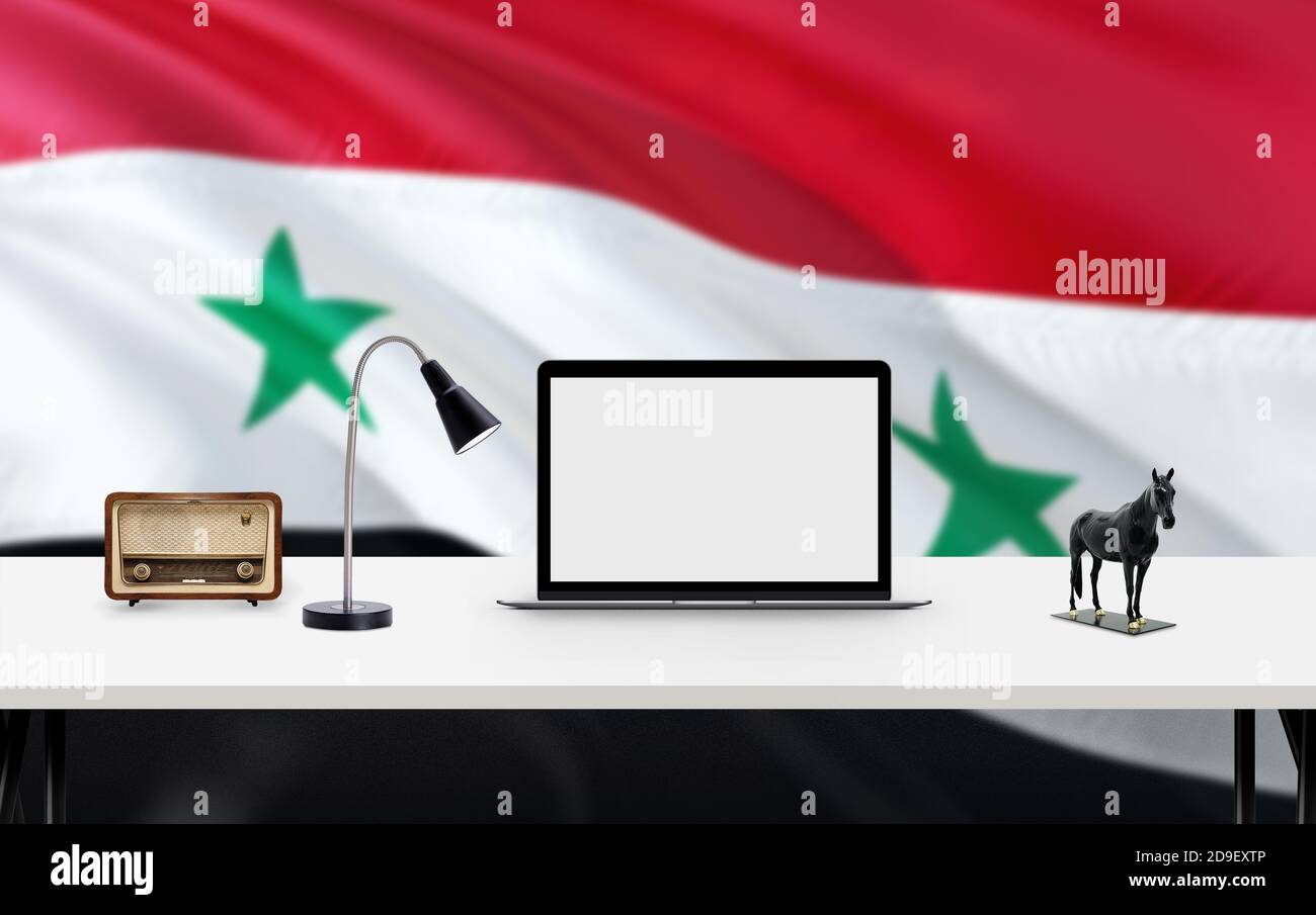 Syria national flag background with workspace, desktop computer and ...