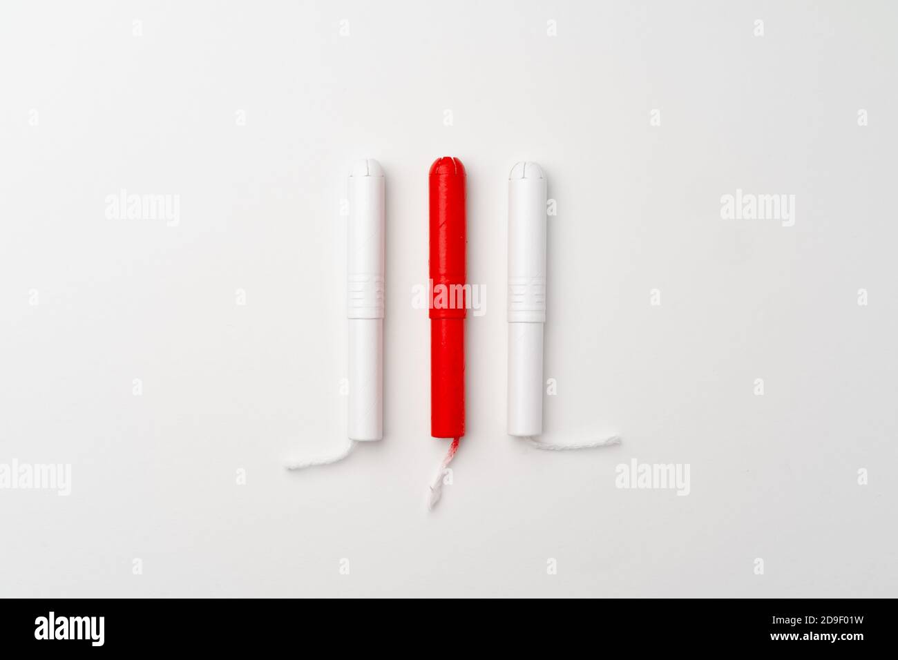 Red and white woman medical tampons on white background Stock Photo - Alamy