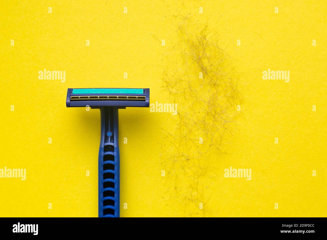 Safety razor on yellow hi-res stock photography and images - Alamy
