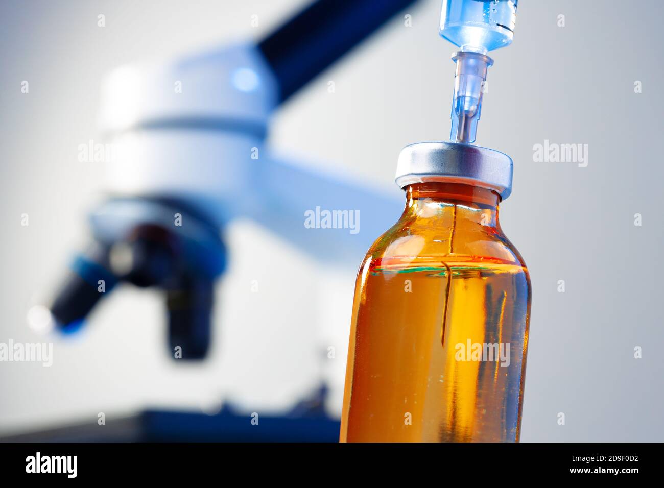 Medical vial with medication and syringe close up Stock Photo - Alamy