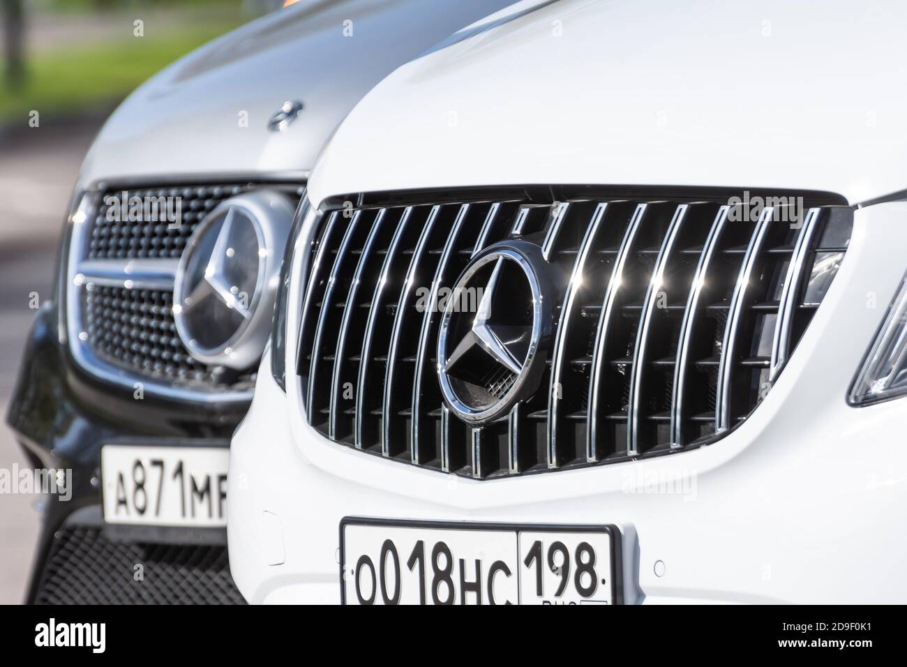 White Mercedes-Benz V class, front view minivan in a row in a parking ...