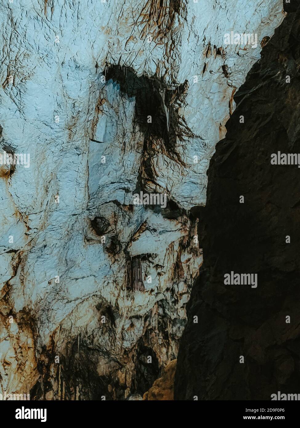 Vertical shot of an old cave Stock Photo - Alamy