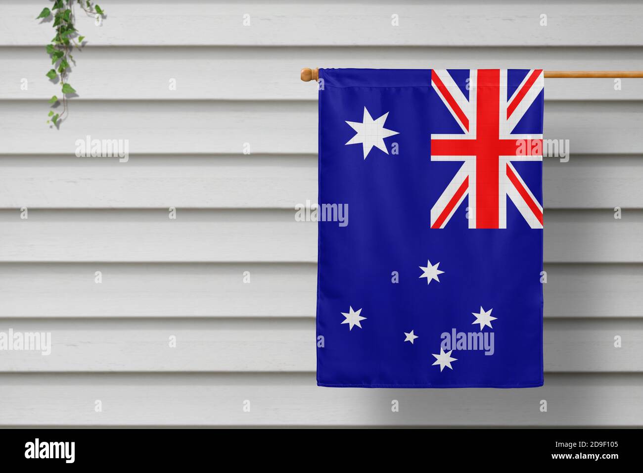 Australia national small flag hangs from a picket fence along the ...