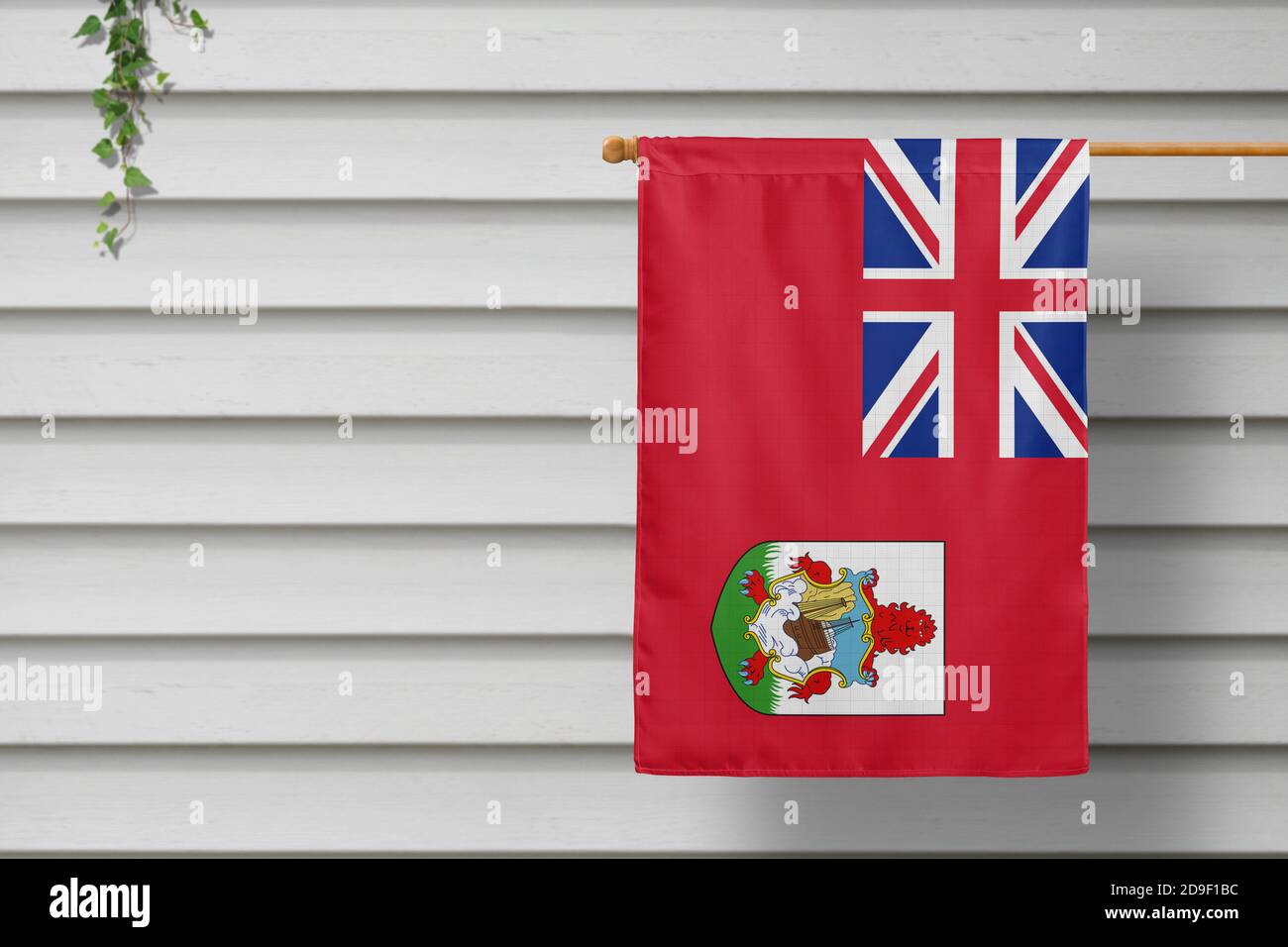 Bermuda national small flag hangs from a picket fence along the wooden ...