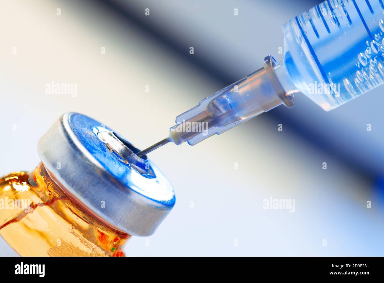 Medical vial with medication and syringe close up Stock Photo - Alamy