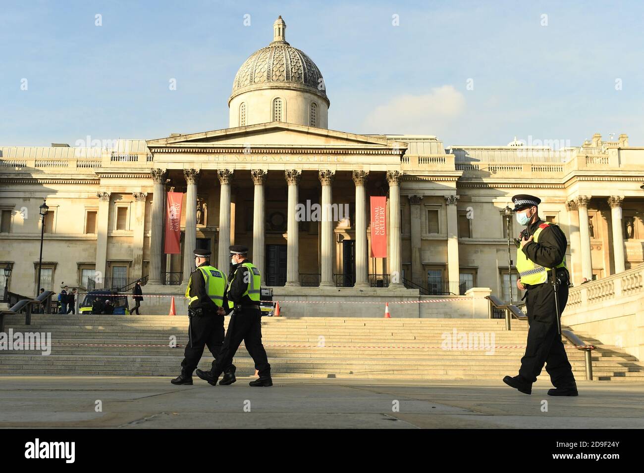 Police in a quiet Trafalgar Square, London, at the start of a four week ...