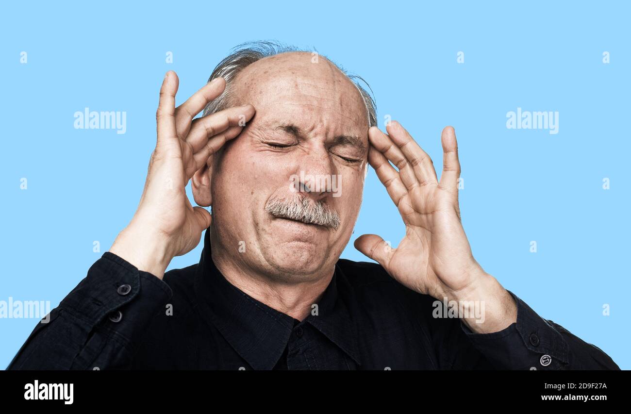 Old man feeling tired and headache. Strong headache. Health care ...