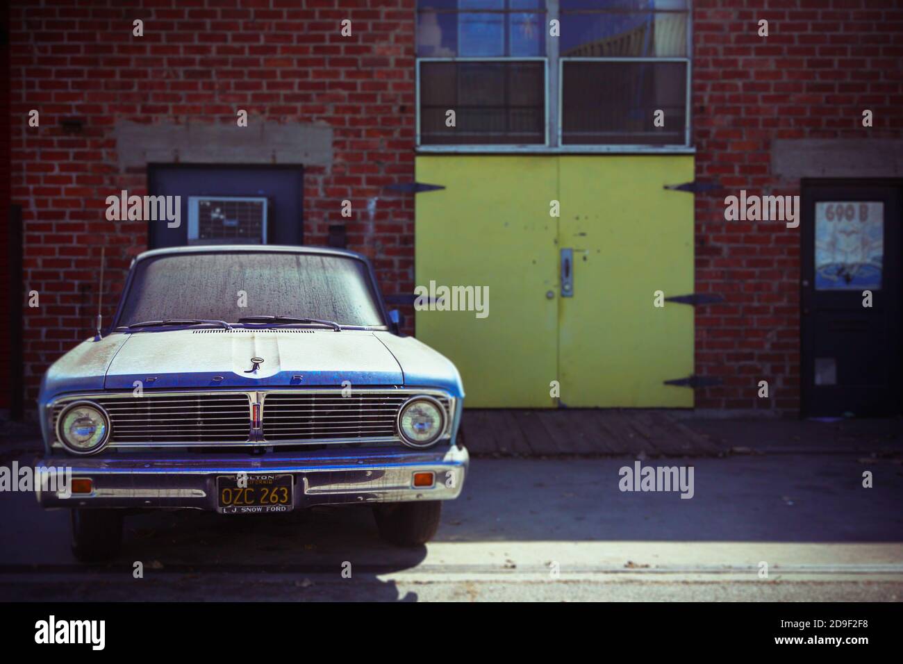 old blue car in front of a brick wall, los angeles, United states Stock ...