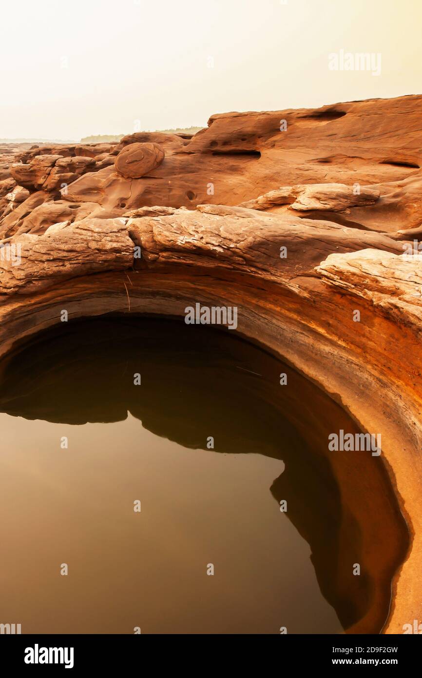 Art shape of sandstone pool in Mekong River in summer, it is eroded by ...