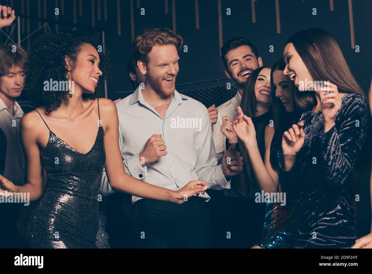 Photo of students company celebrating prom party in night club dancing ...