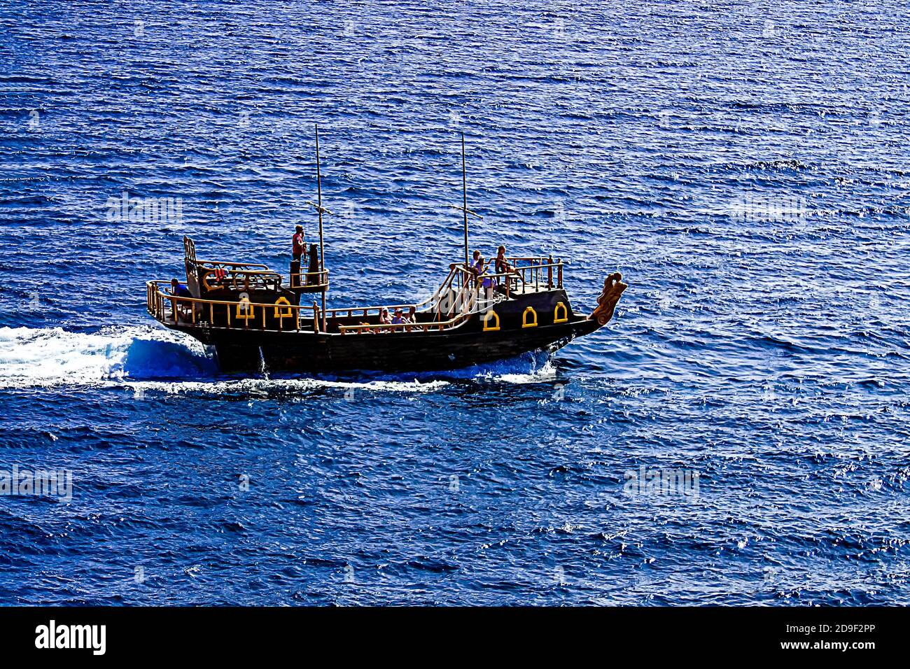 Boat in the form of galleys on black sea Stock Photo - Alamy