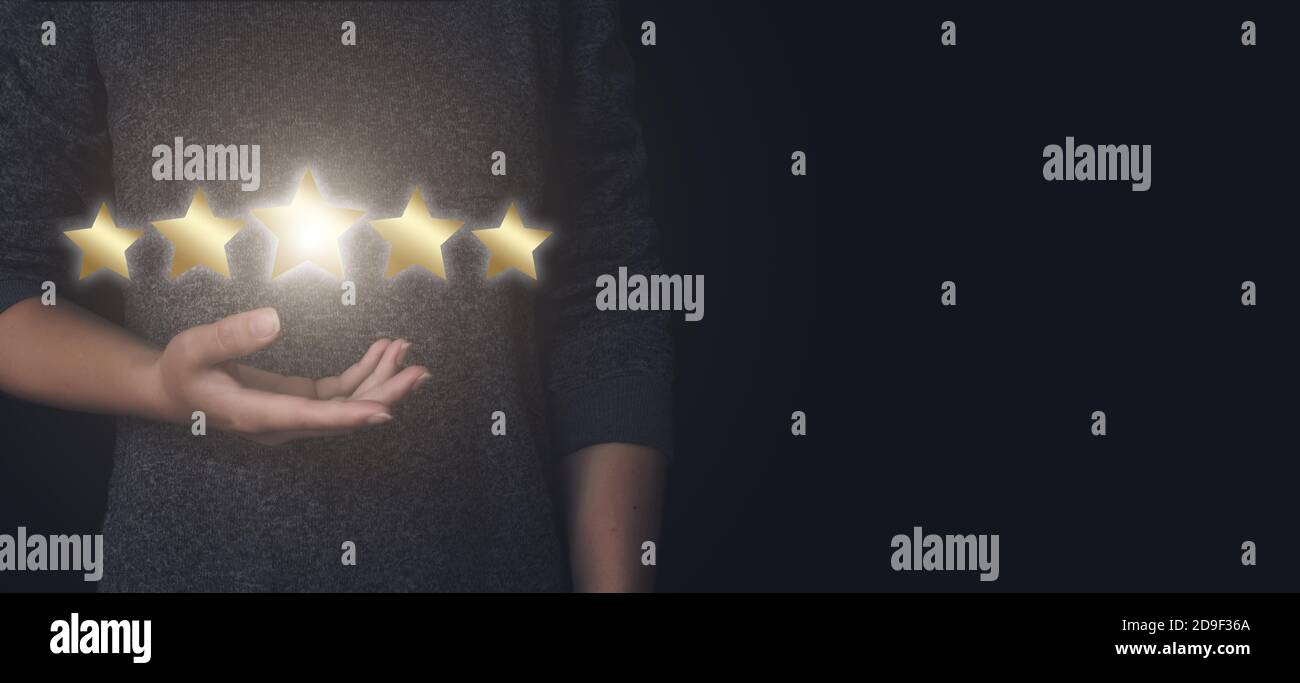 Five Star Rating. Hand holds the fifth star. Quality level, good ...