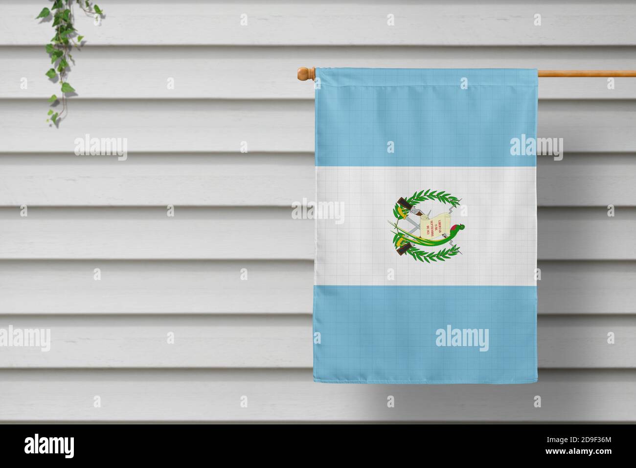 Guatemala national small flag hangs from a picket fence along the ...