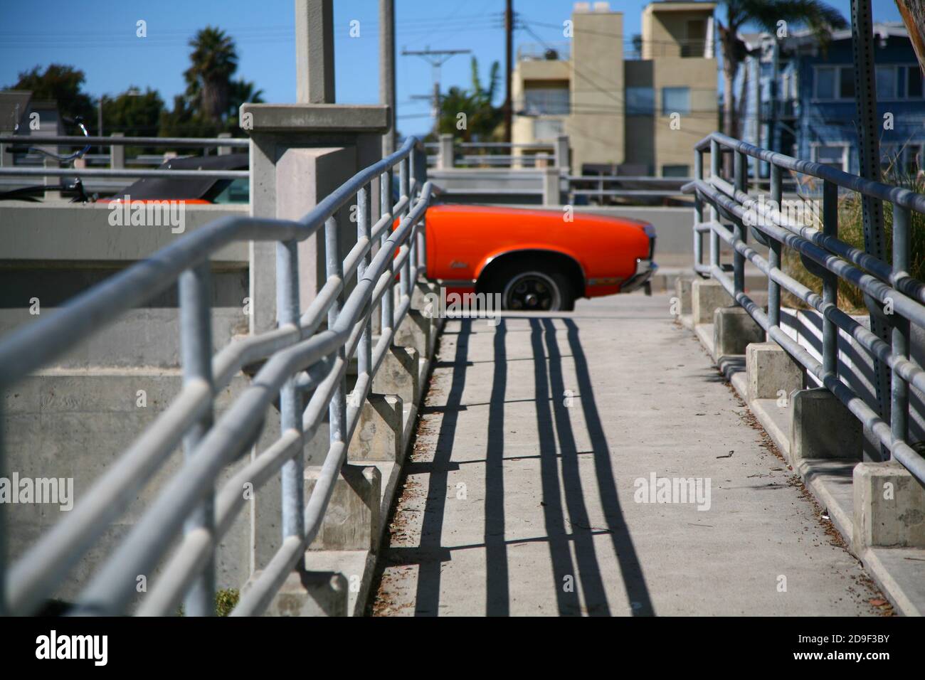 orange vintage car parked near a footbridge Stock Photo - Alamy