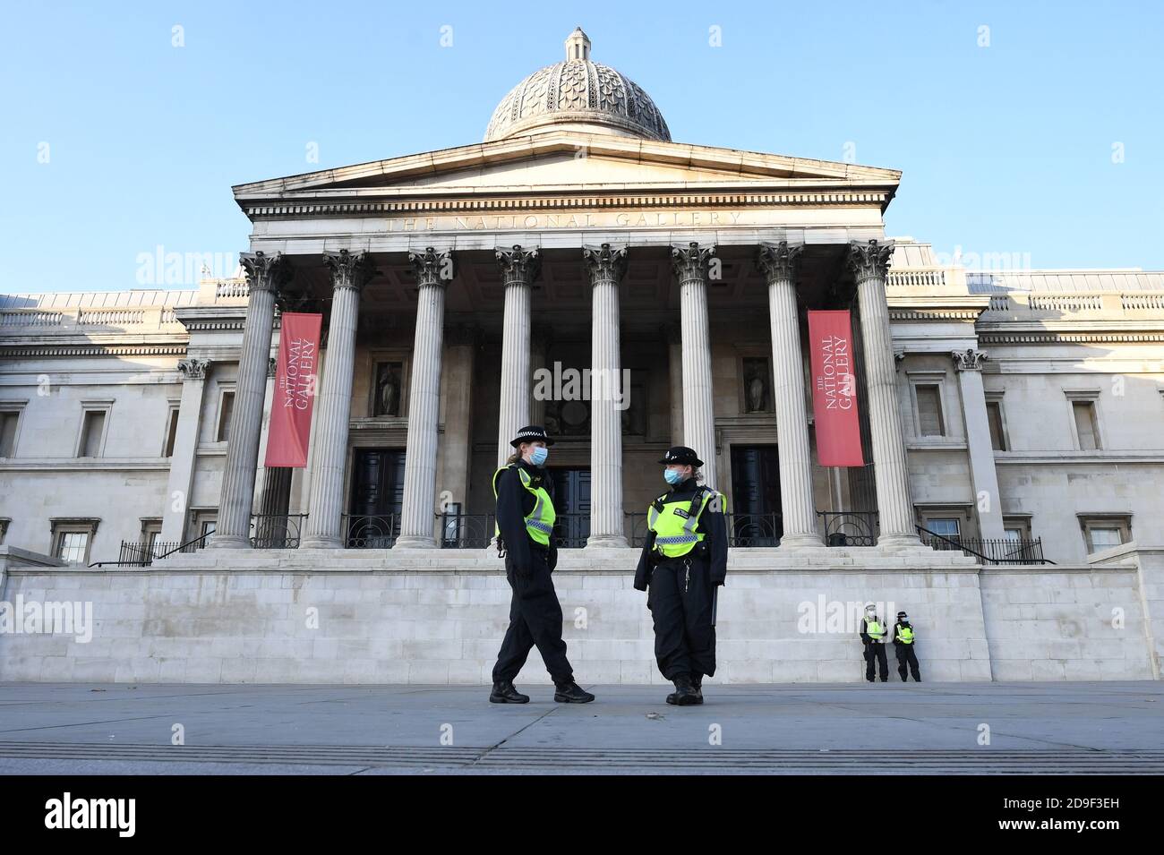 Police in a quiet Trafalgar Square, London, at the start of a four week ...