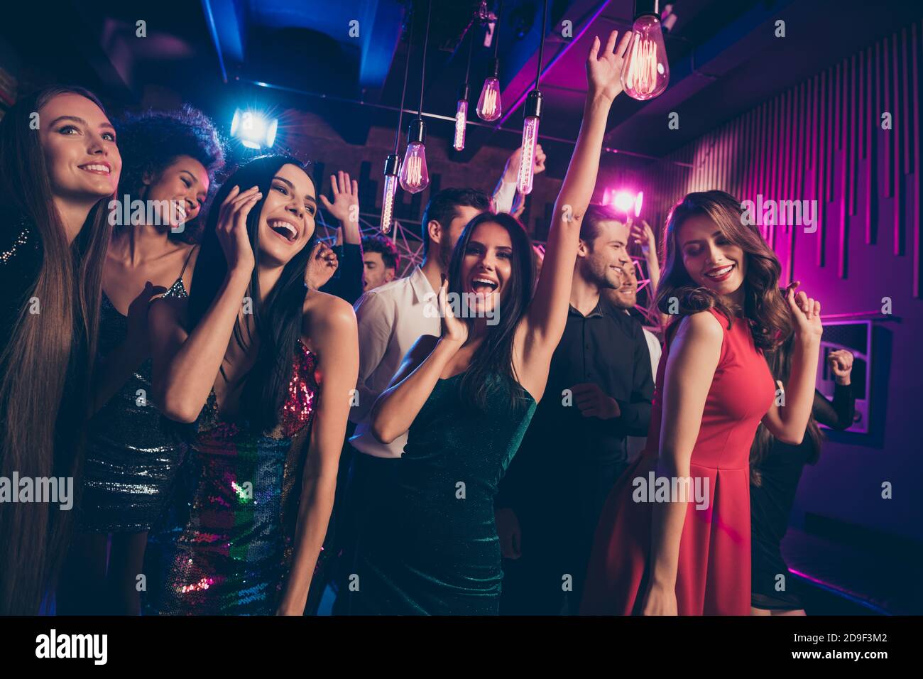 Photo portrait of happy young people dancing together cheering raising ...