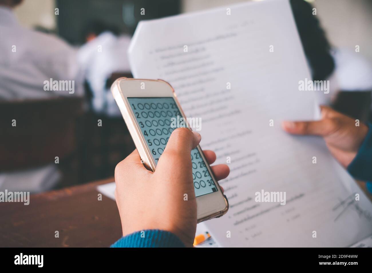 Exam by students doing educational test with using smartphone Stock ...