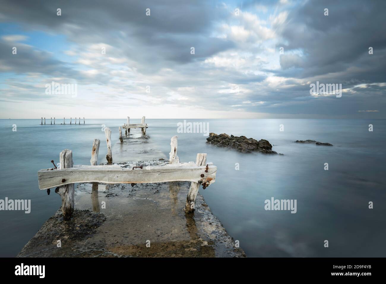 Long exposition of stunning scene of an old abandoned jetty under a ...