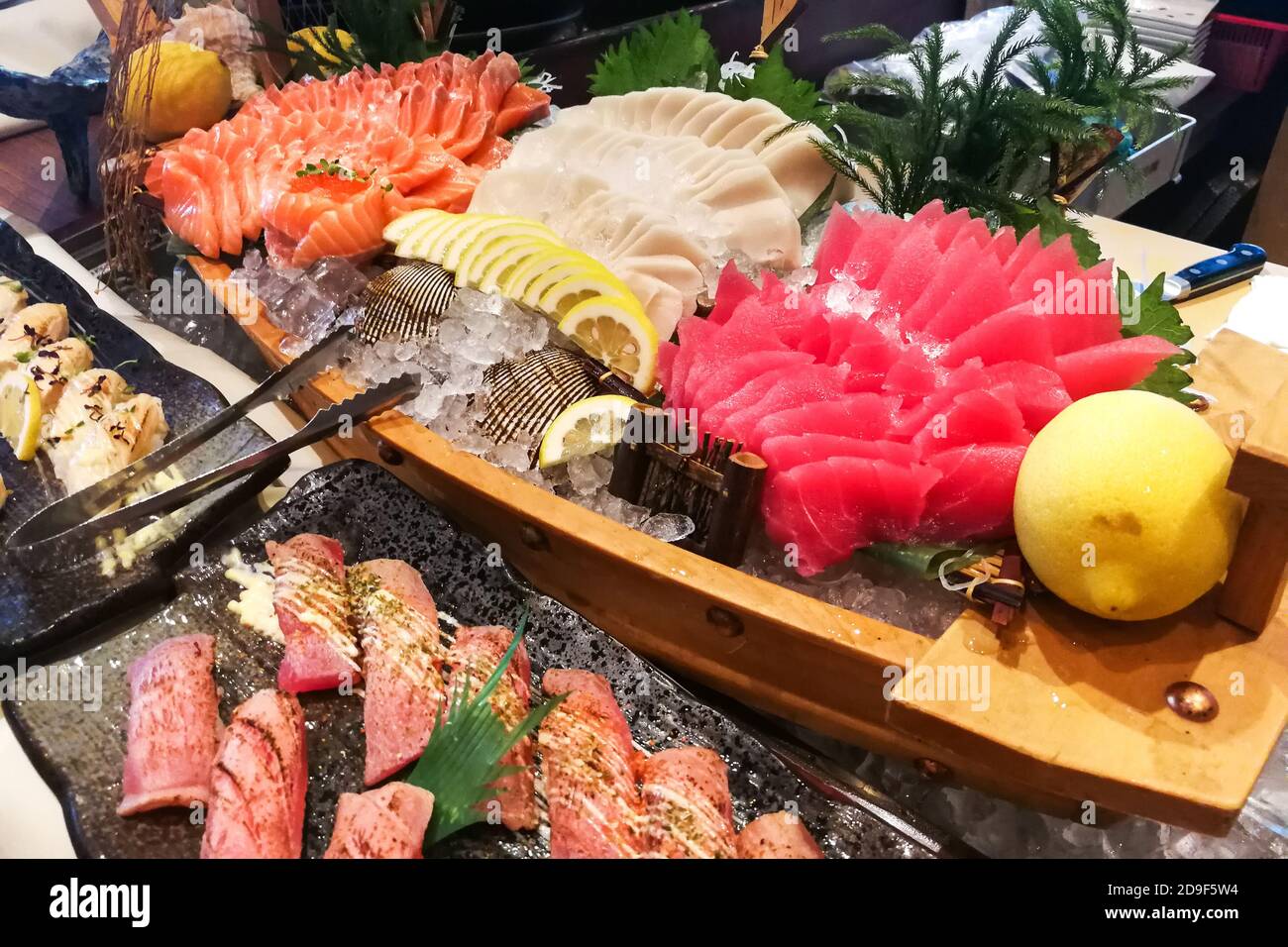 Delicious Japanese fresh sashimi sushi buffet spread at restaurant ...