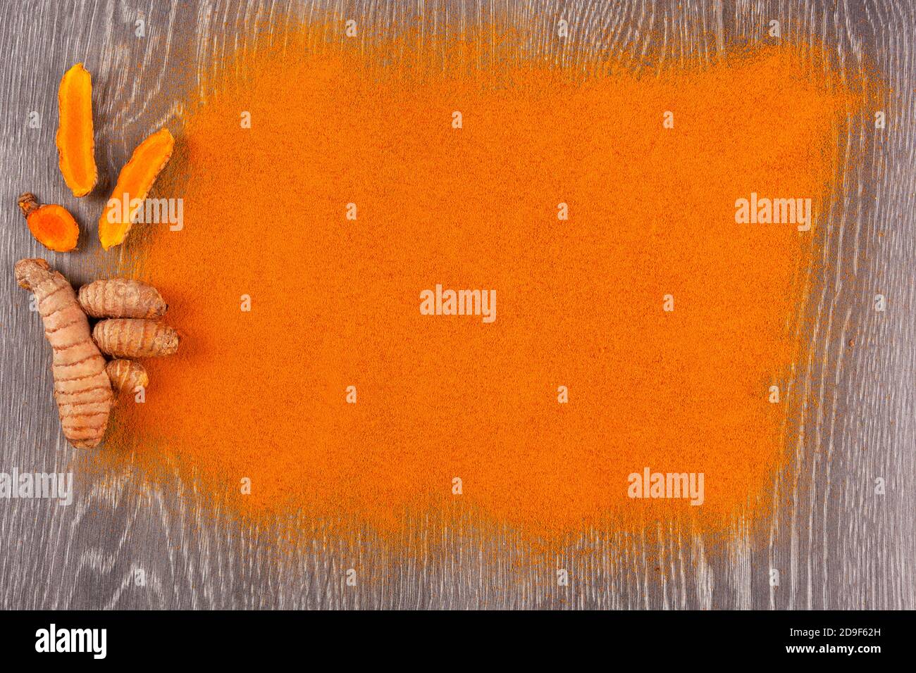 Turmeric root and curcuma spice background. Herbal medicine, nutrional ...