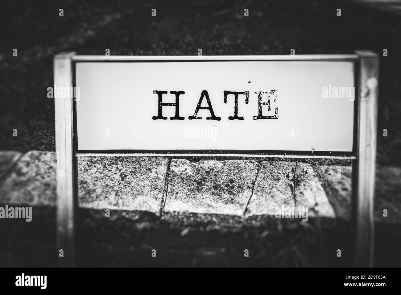 Hate on a road sign Stock Photo - Alamy