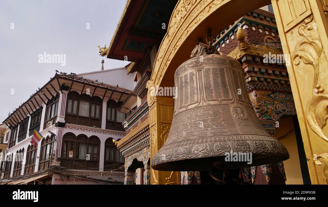 Huge metal clock mounted to a Buddhist temple near famous Boudhanath ...