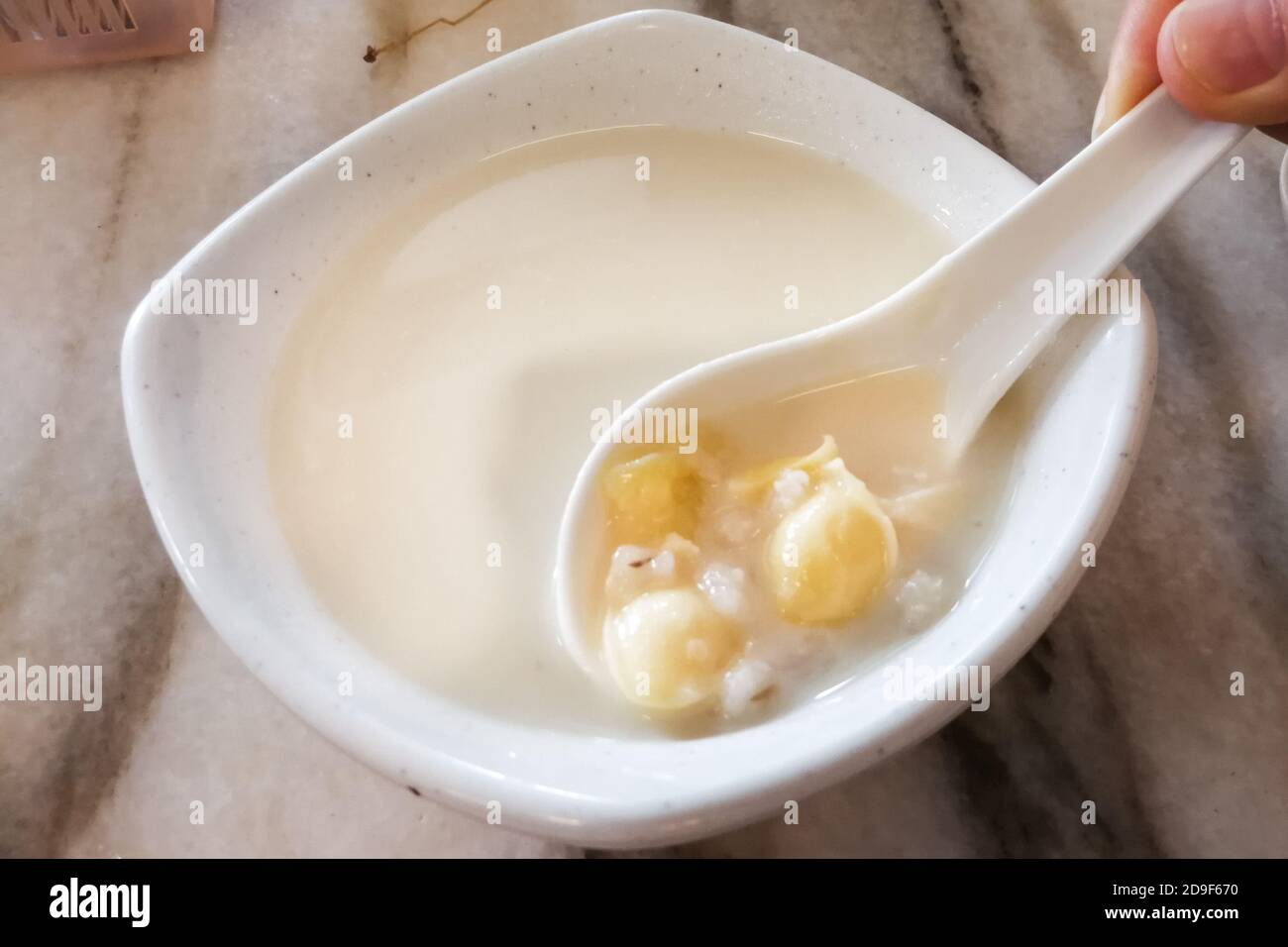 Barley drink cooked with soya and ginkgo nuts healthy preparation Stock ...