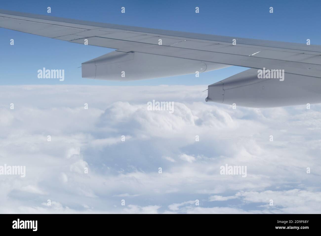 plane wing and cloud floating on sky through window frame Stock Photo ...