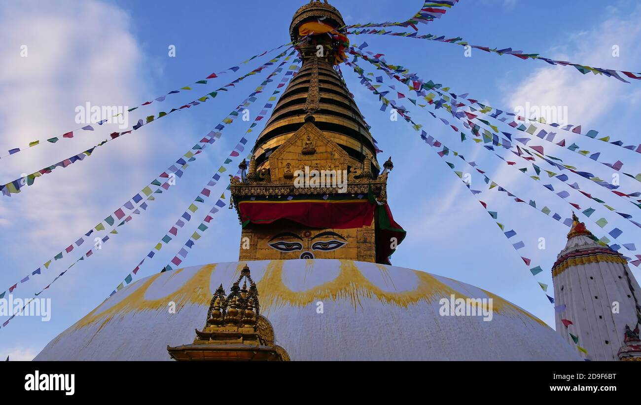 Front view of the top of golden colored Buddhist stupa in temple ...
