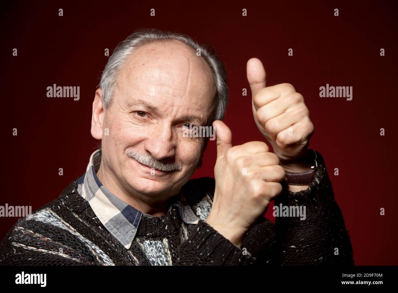 Successful man shows ok sigh Stock Photo - Alamy