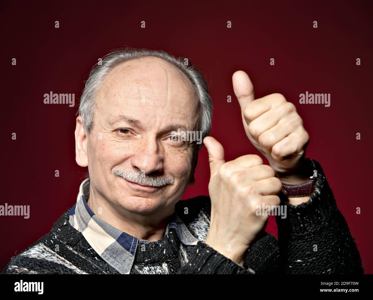 Successful man shows ok sigh Stock Photo - Alamy