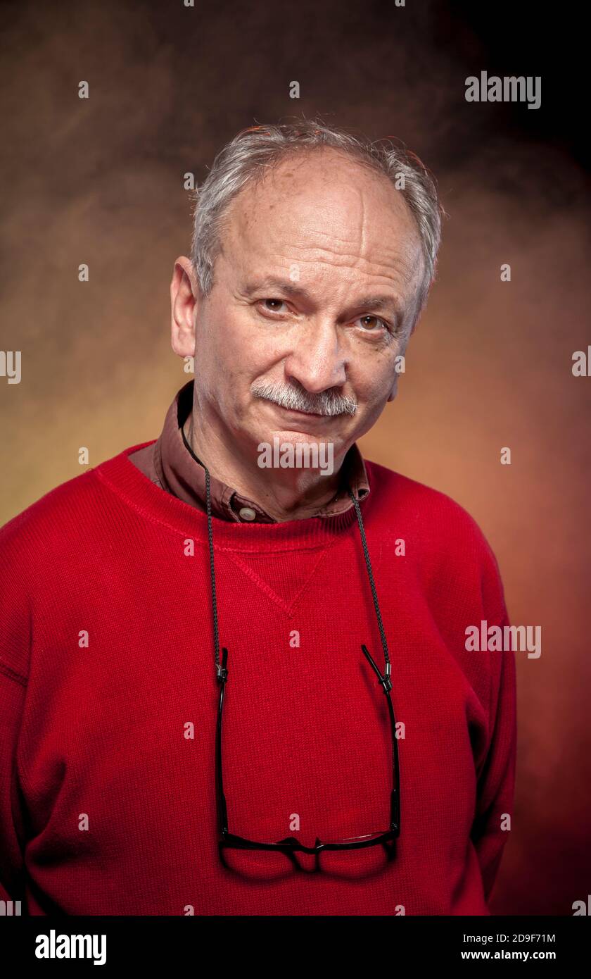Person wearing red jacket hi-res stock photography and images - Alamy