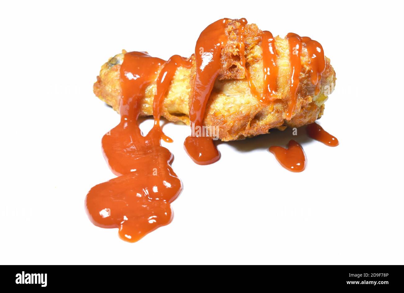 crispy fried chicken leg dressing ketchup sauce on white background ...