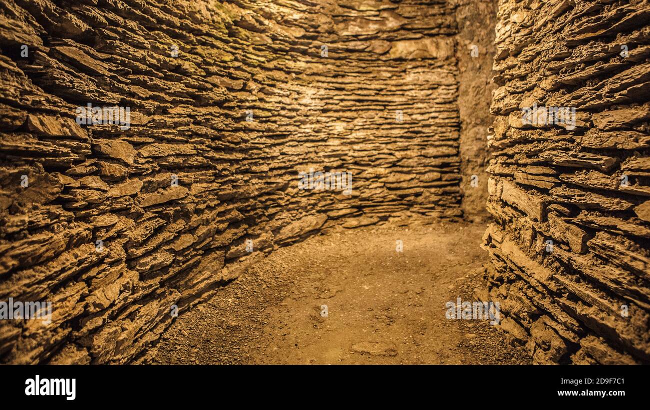 Landscape of narrow path between high stone walls Stock Photo - Alamy