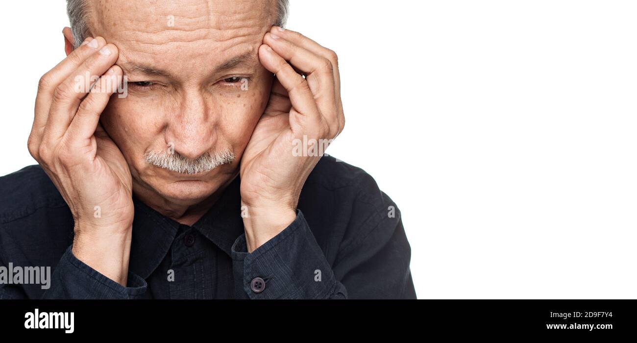 Old man suffering from a headache isolated on white background with ...