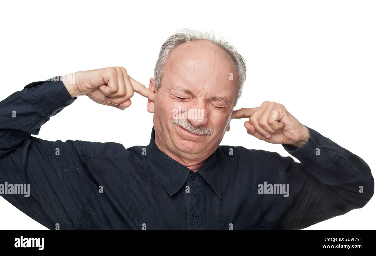 A man covers his ears with his hands. Suffering from a loud sound Stock ...