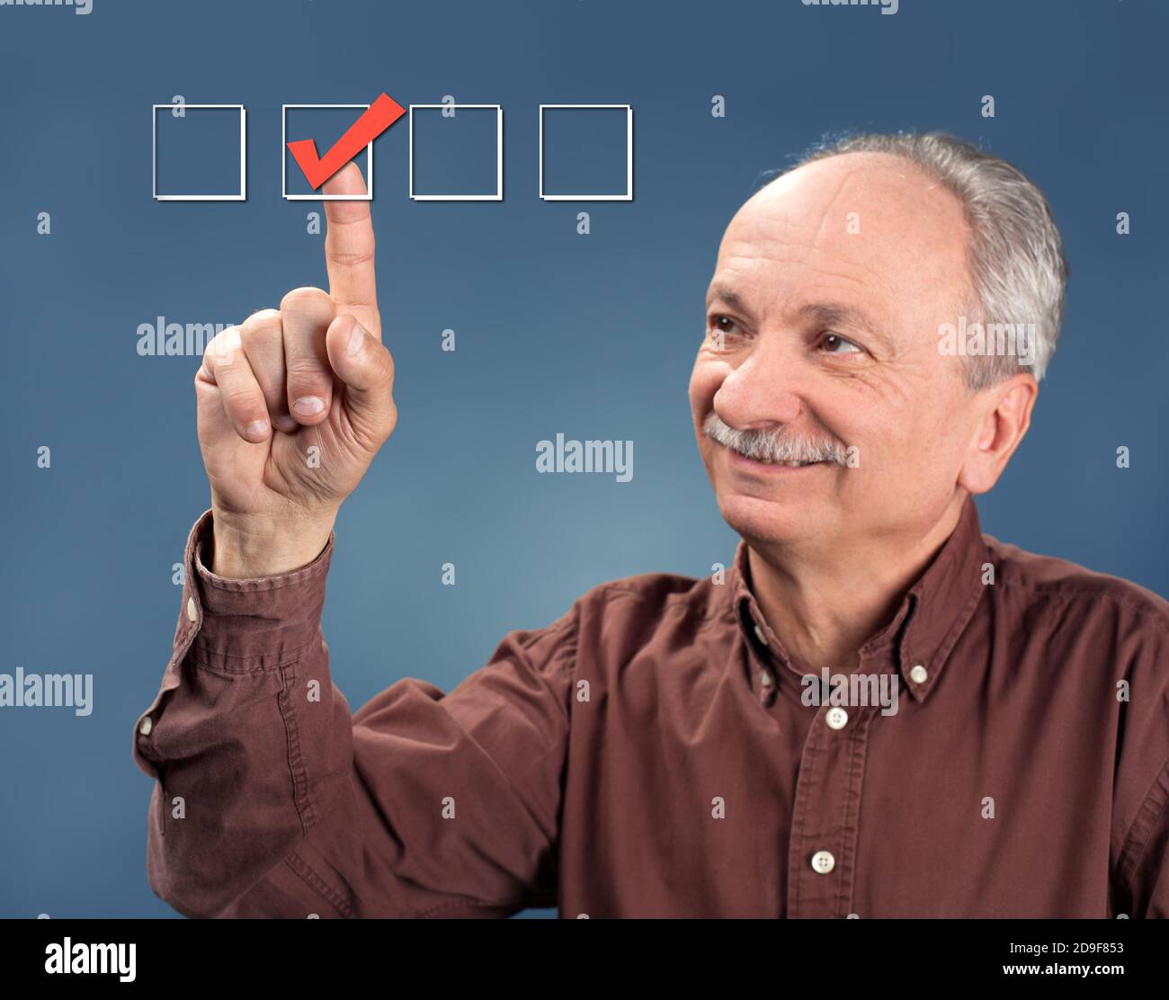 Old man choose check mark on box Stock Photo - Alamy